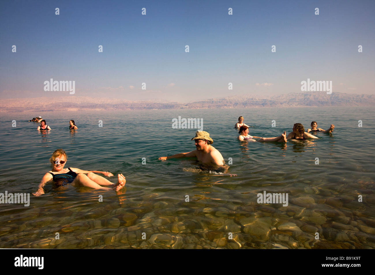 Tourists wading and floating in Dead Sea, Israel, Middle East Stock ...