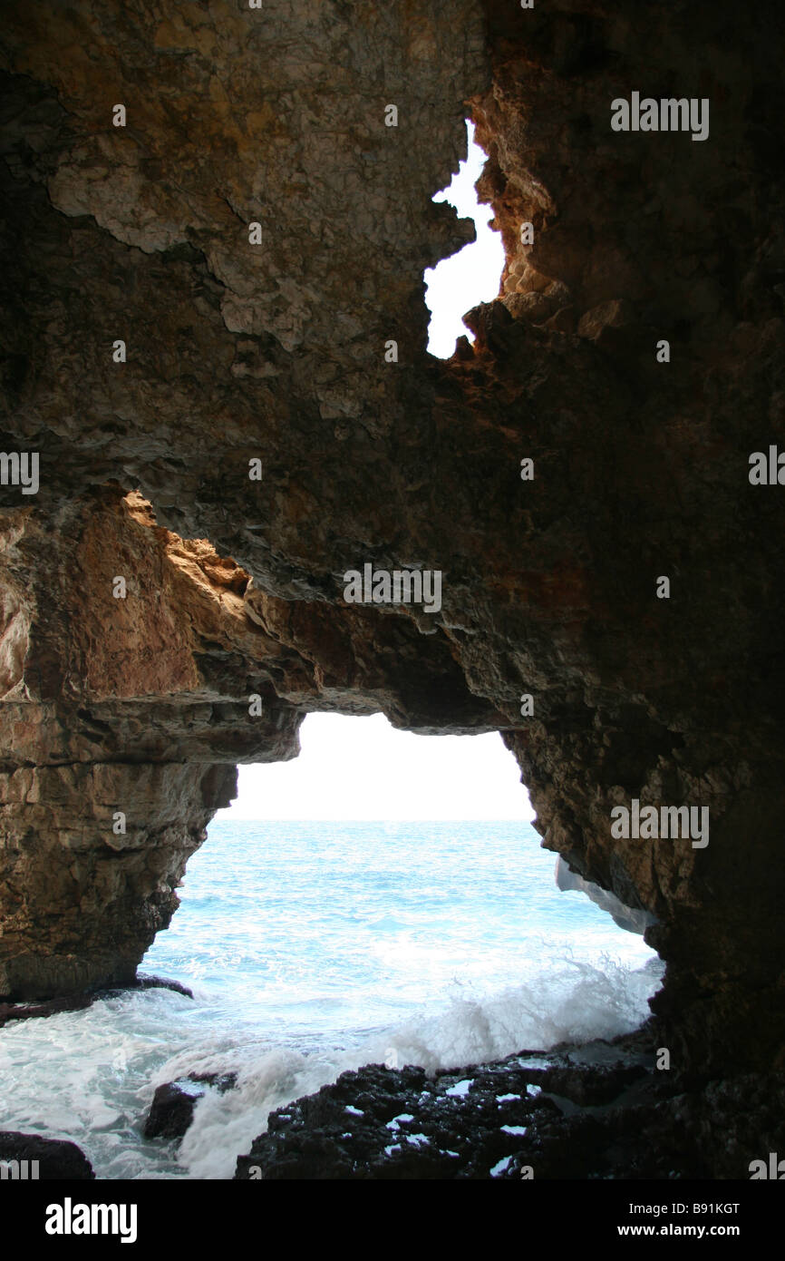 The Cala del Moraig eroded arch and skylight at Playa del Moraig ...