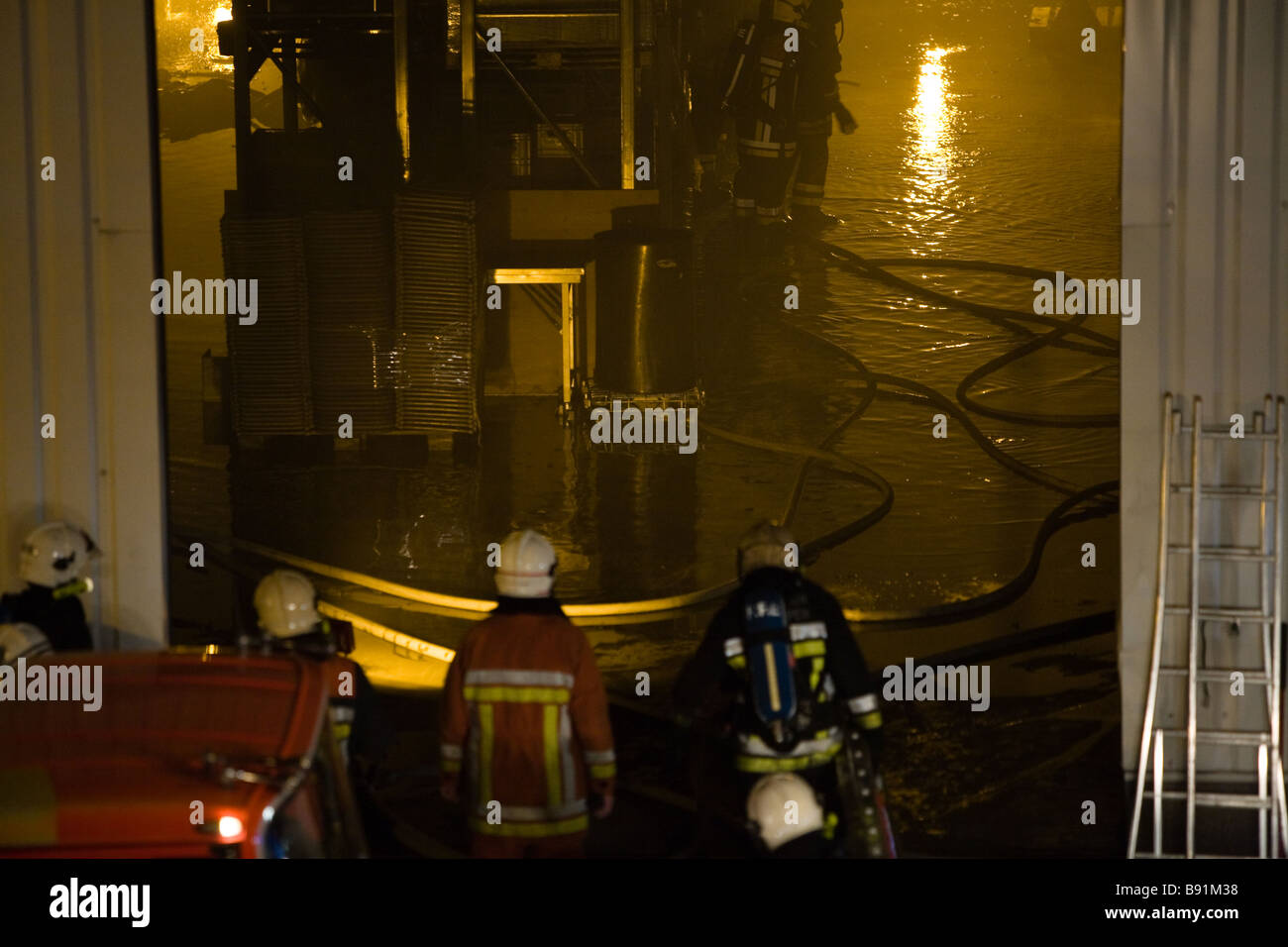 Firefighters at work Stock Photo - Alamy