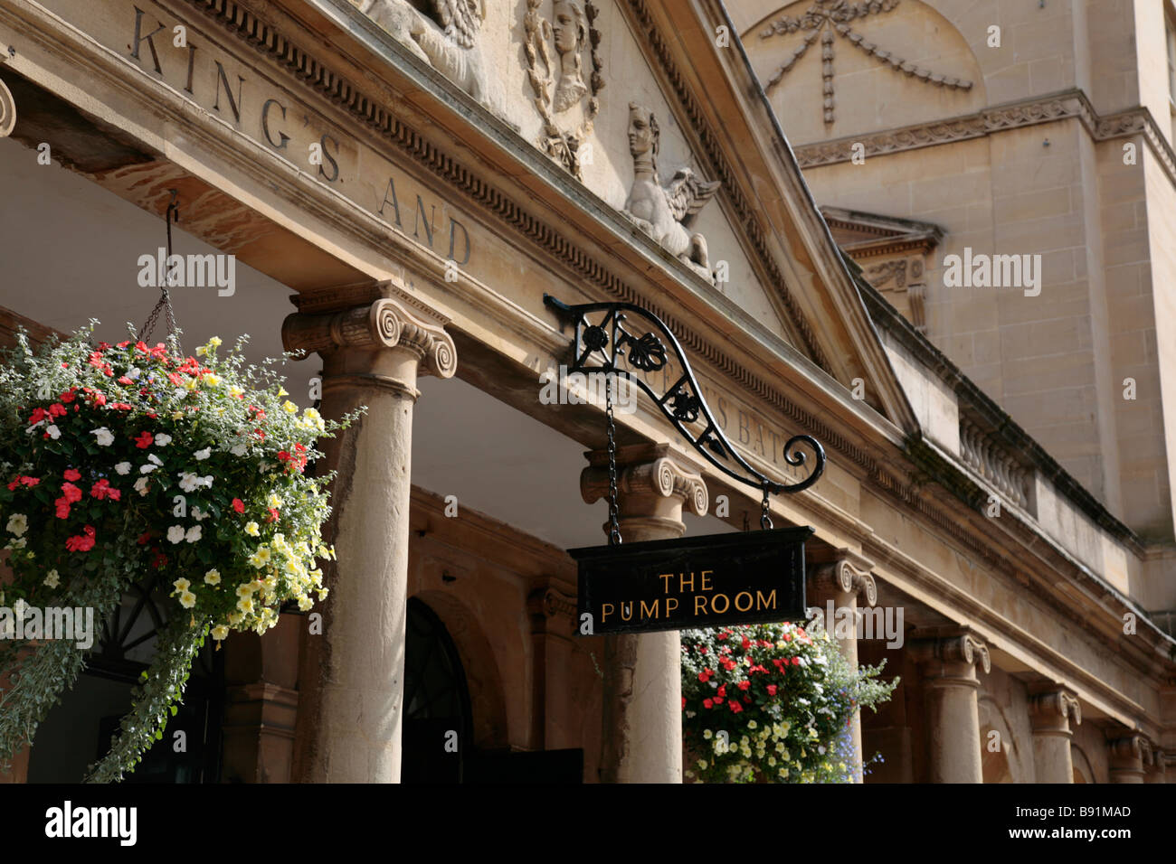 The Pump Room sign, between floral hanging baskets and ionic columns ...