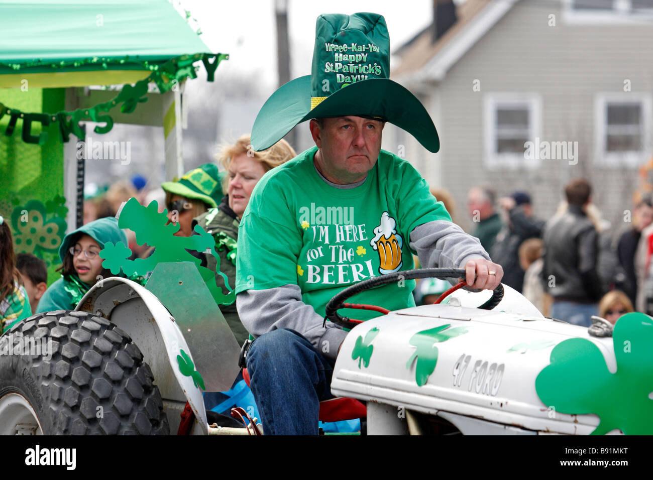 A very bored tractor driver in Holiday dress pulling a float in a St ...