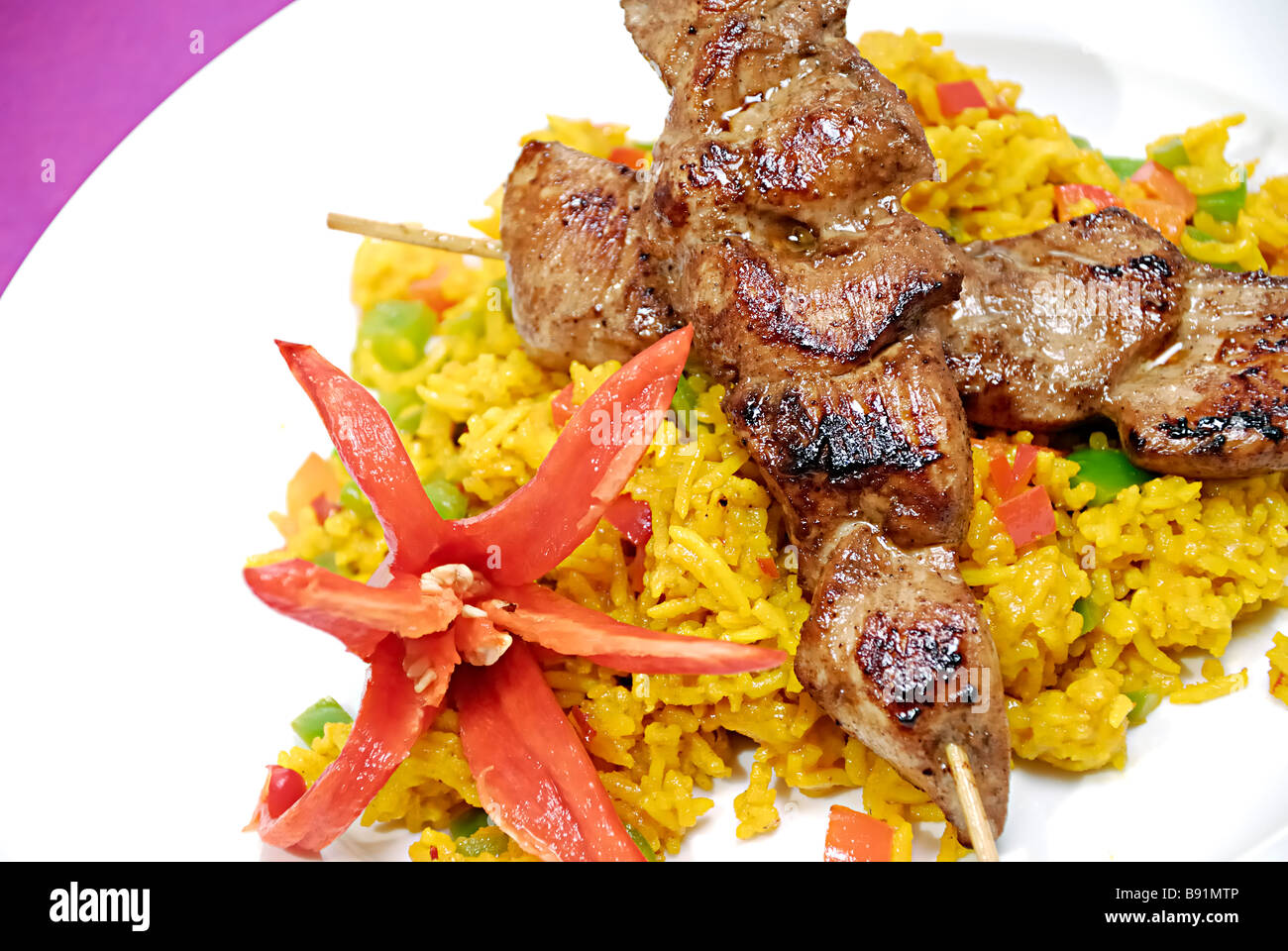 Satay chicken with curry rice Stock Photo - Alamy