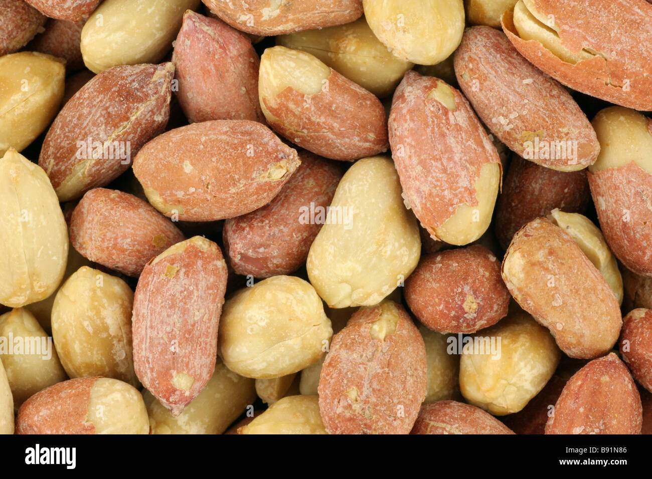 Roasted peanut seeds background Stock Photo - Alamy