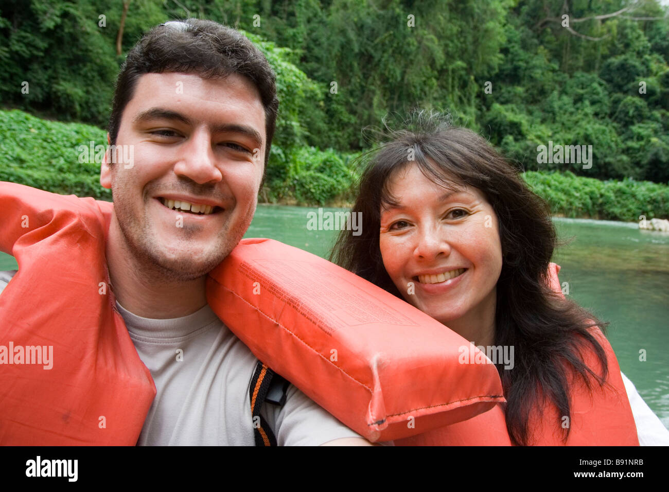 Couple on river raft Stock Photo - Alamy
