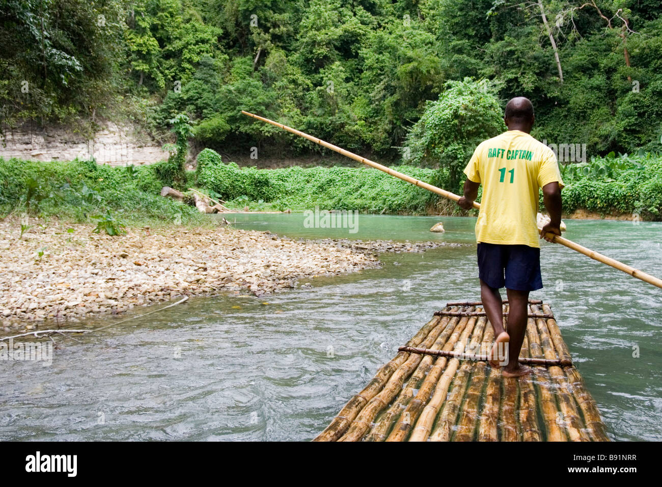 Jamaican river raft and captain Stock Photo - Alamy