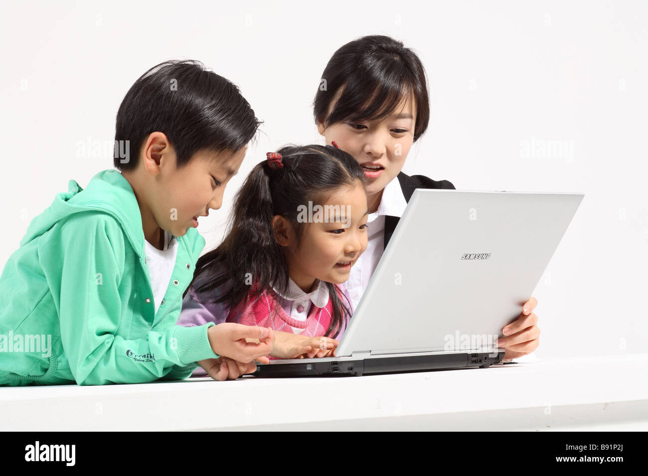Child and Teacher in Study Stock Photo - Alamy