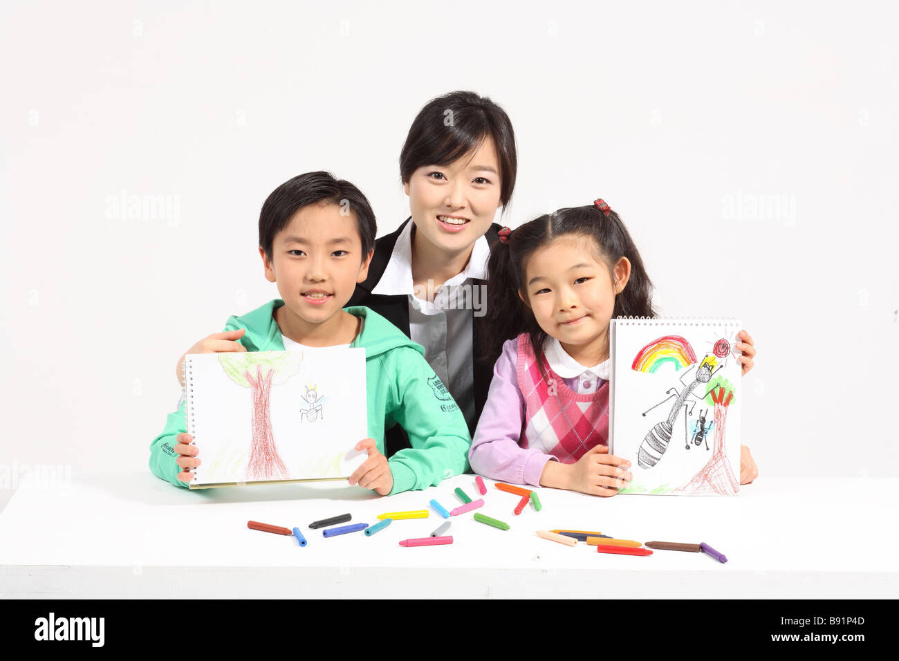 Child and Teacher in Study Stock Photo - Alamy