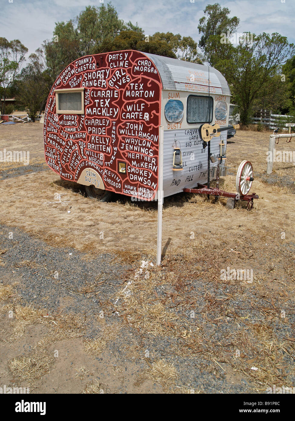 Painted caravan in drought Stock Photo - Alamy