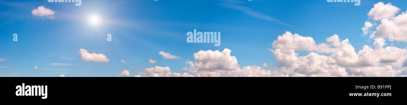 Blue height sky with sun and some clouds. Four shots stitch image Stock ...