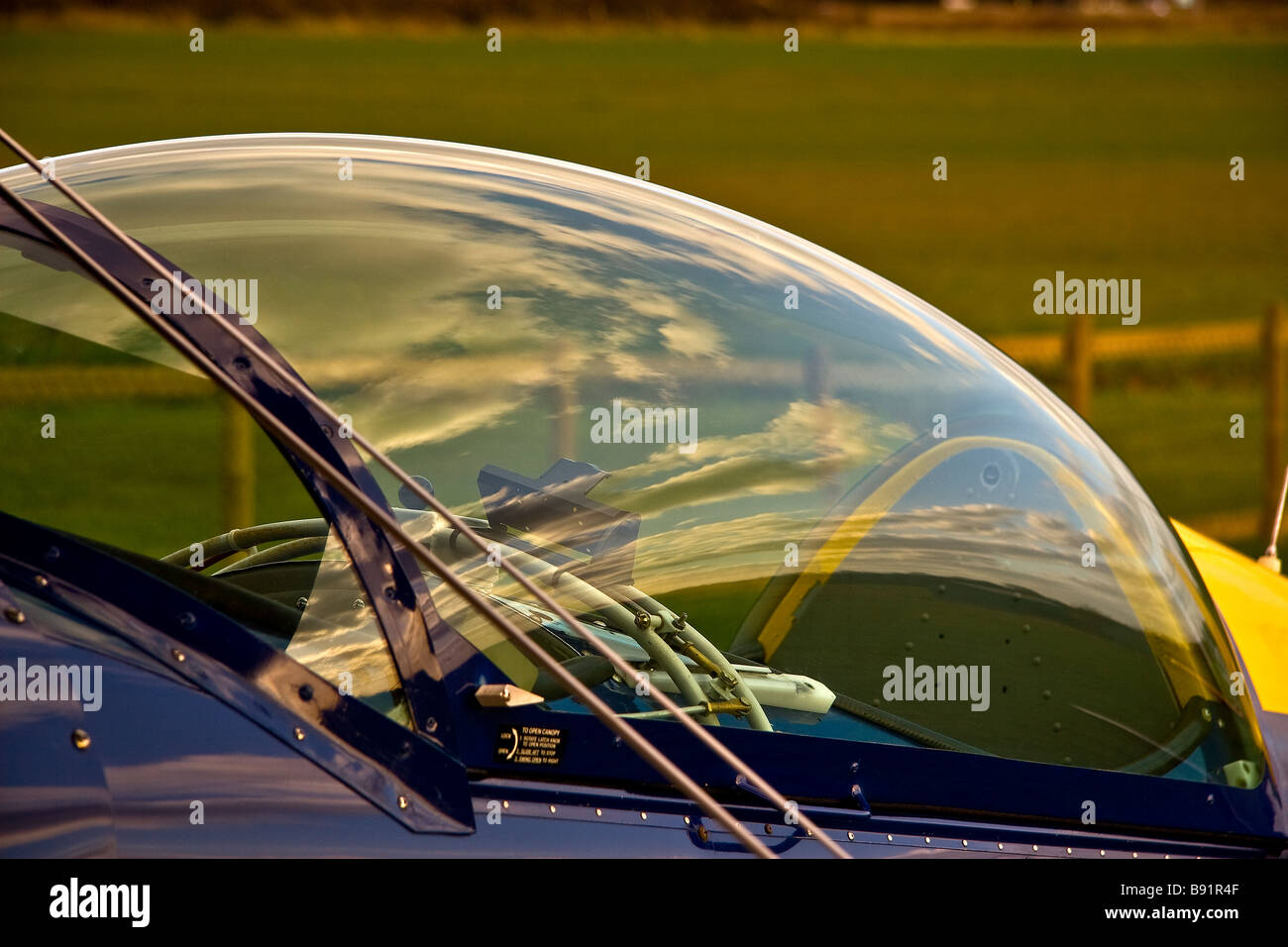 Cockpit of light aircraft showing the reflection of clouds Stock Photo ...
