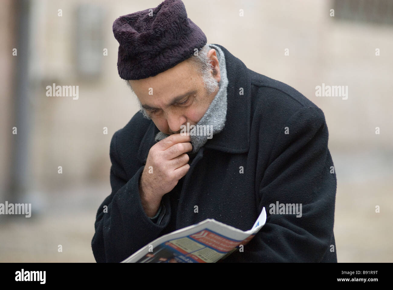 An Israeli man reading a newspaper in Jerusalem Israel Stock Photo - Alamy