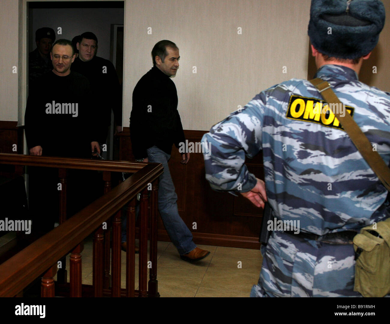 Imran Ilyasov center and other armed group members being escorted to the Moscow City Court to be ...