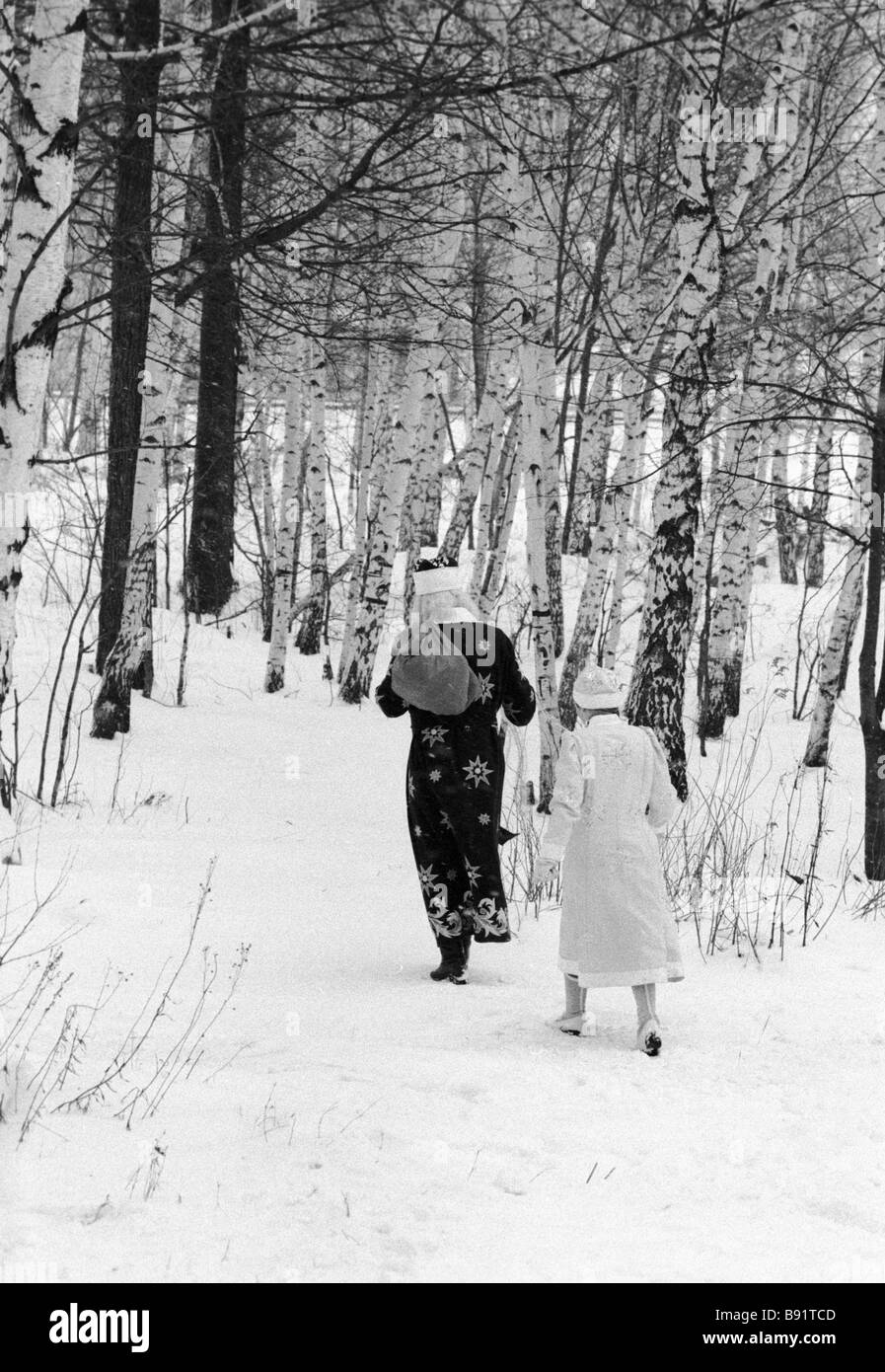Father Frost and the Snow Maiden with the gifts for the children Stock ...