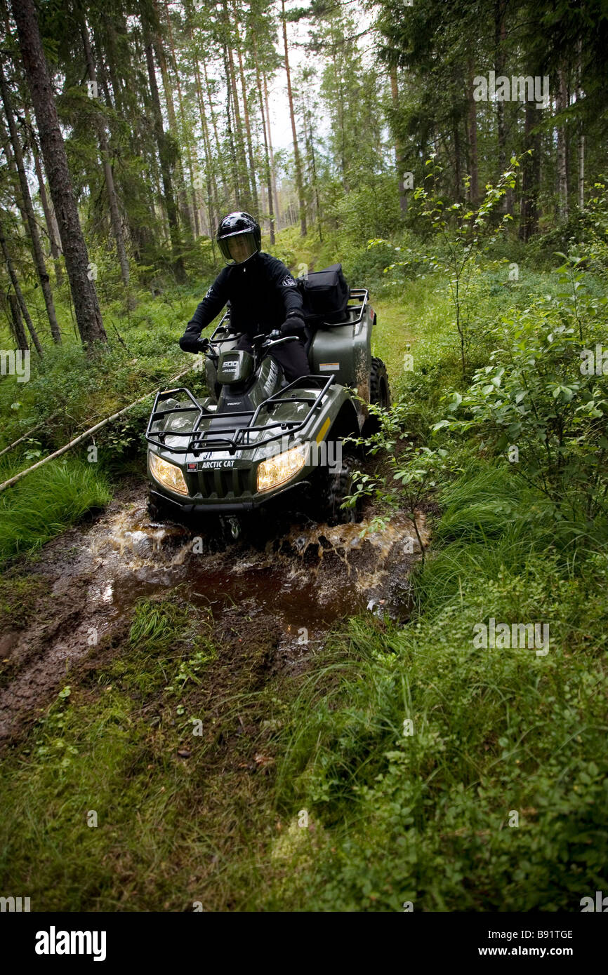 Four-wheeler in a forest Sweden Stock Photo - Alamy