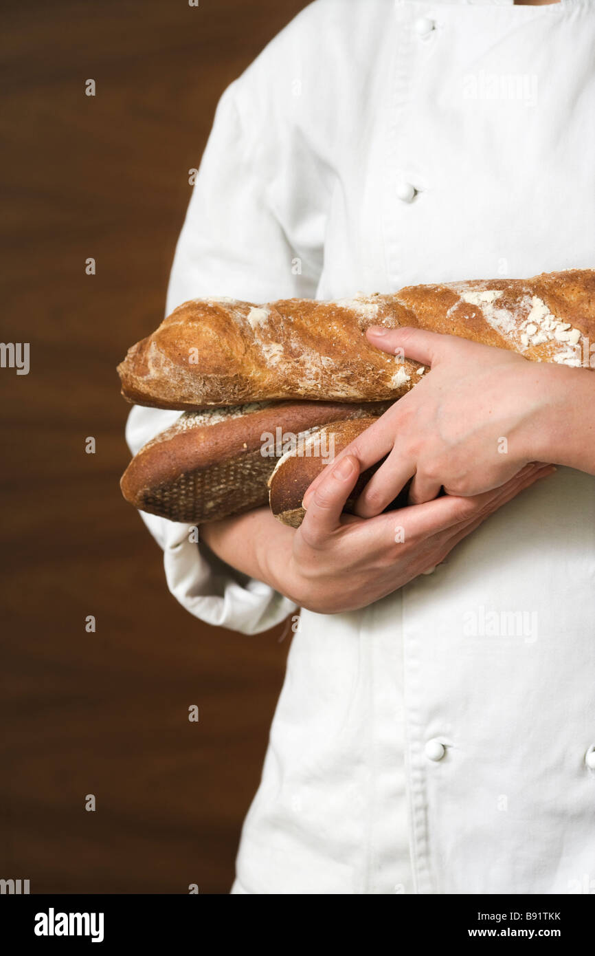 Woman newly baked bread hi-res stock photography and images - Alamy