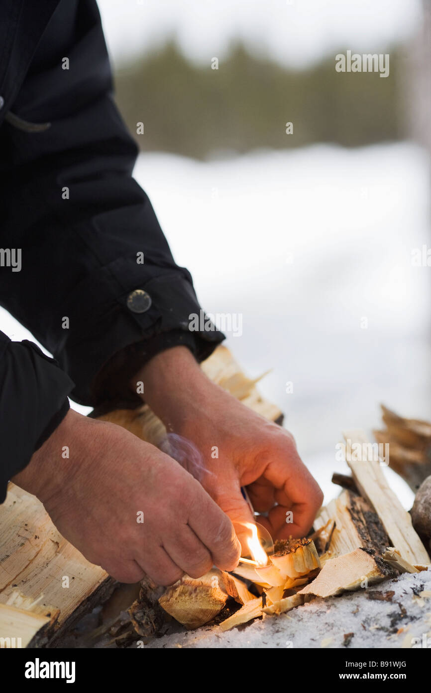 A man making a fire Norrland Sweden Stock Photo - Alamy