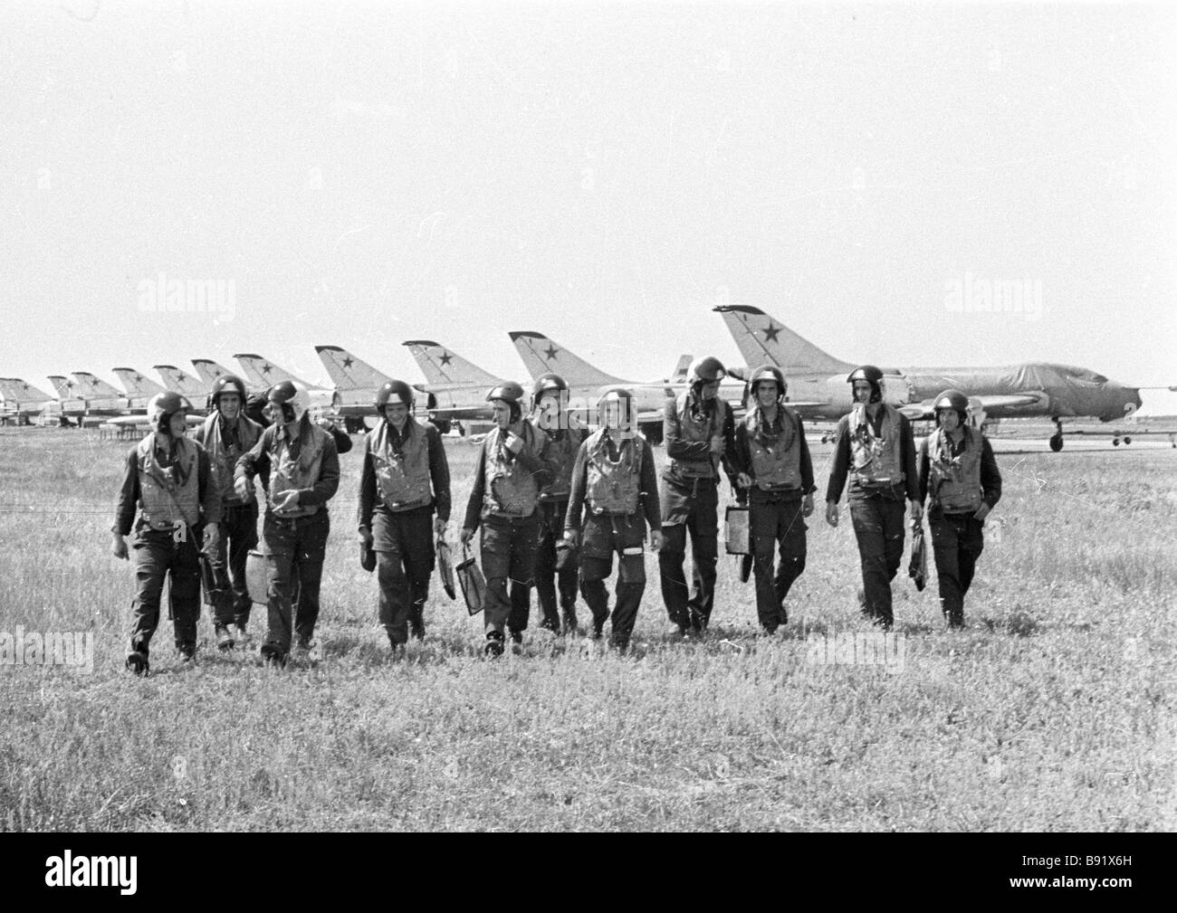 Fighter pilots walk the aerodrome after the flight Stock Photo - Alamy