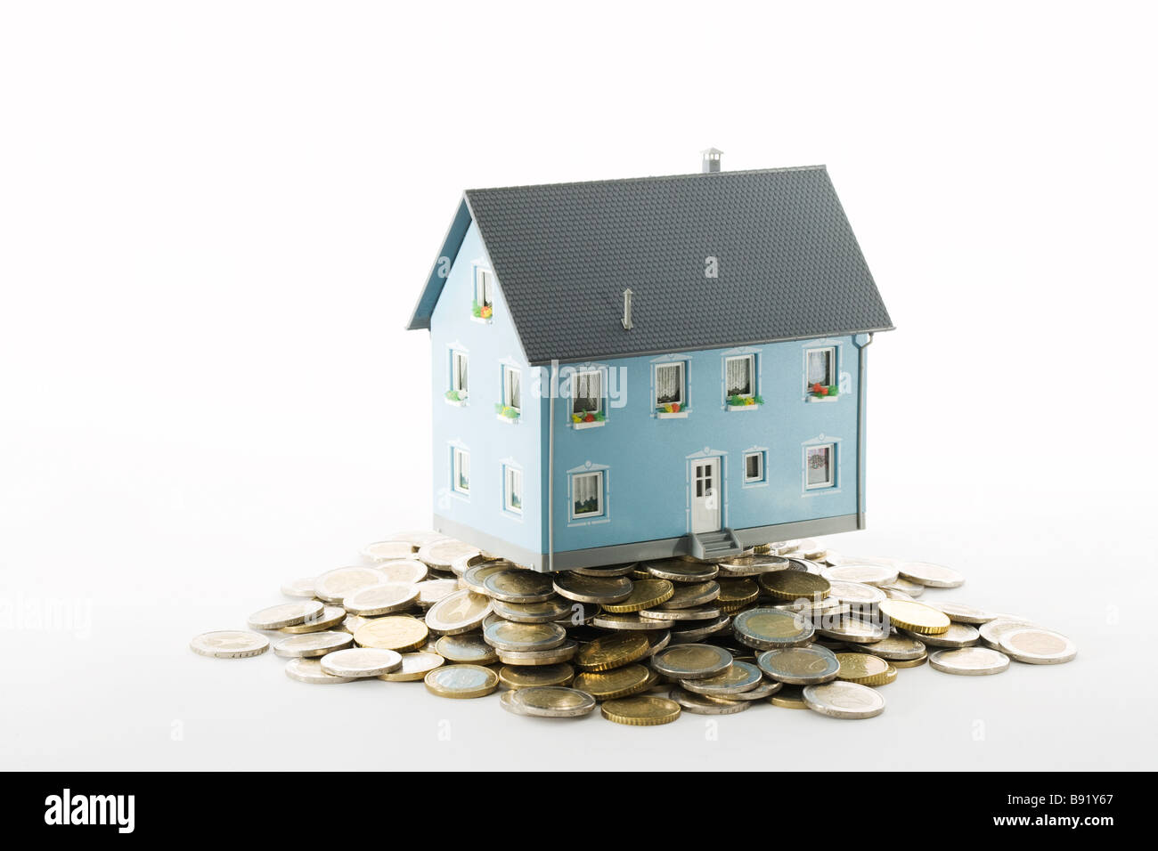 Miniature house and euro coins hi-res stock photography and images - Alamy