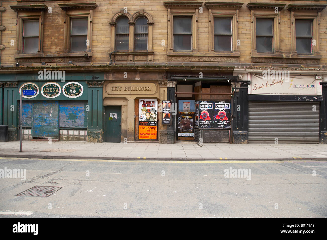 Closed down shops in City buildings Manchester UK Stock Photo - Alamy