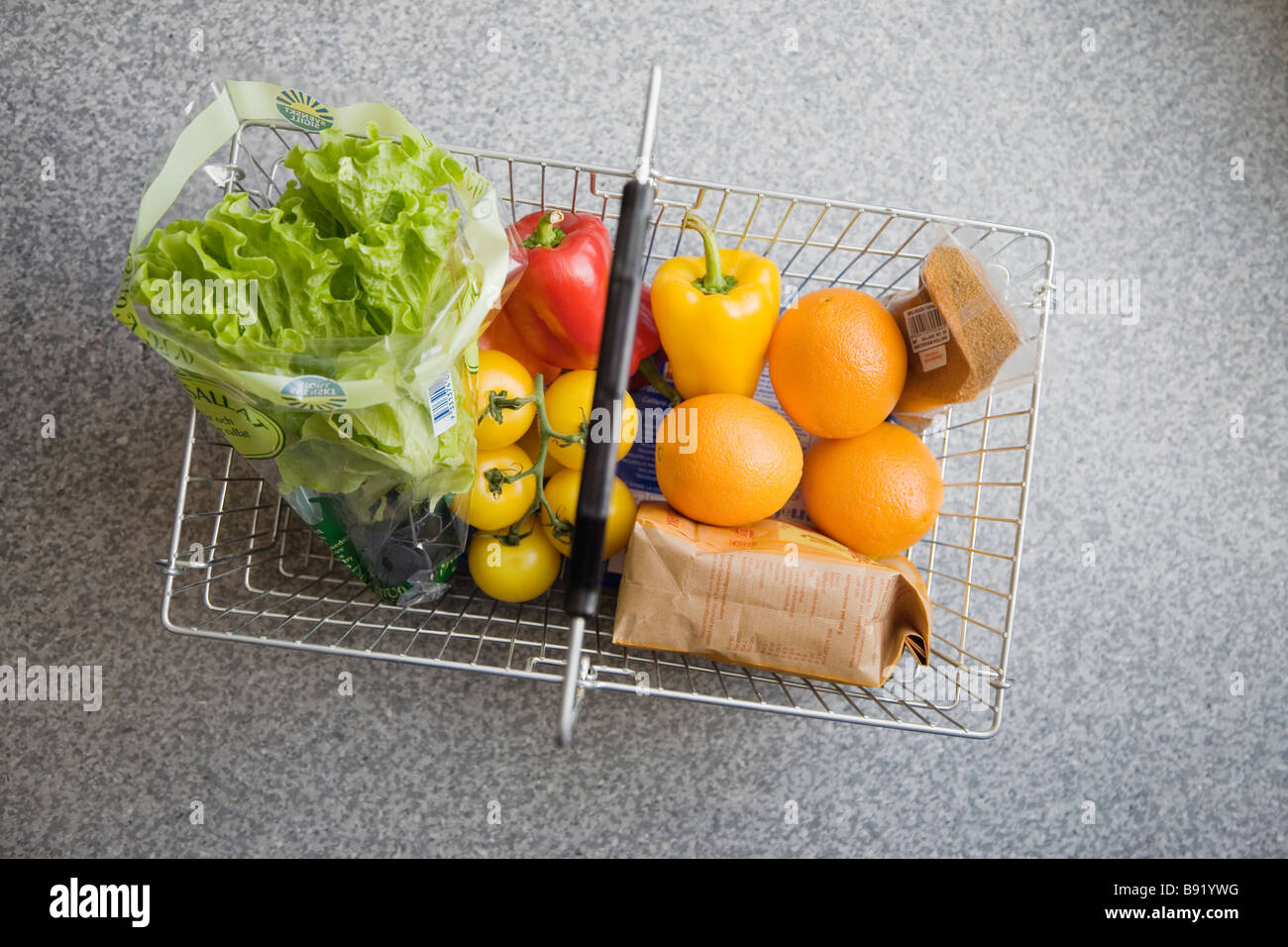 Food in a shopping basket Stock Photo - Alamy
