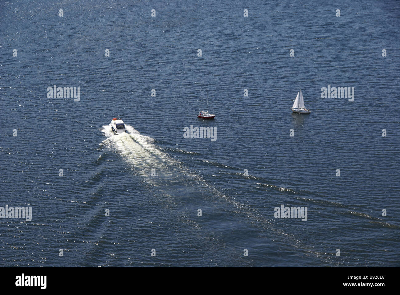Three boats on a lake Stock Photo - Alamy