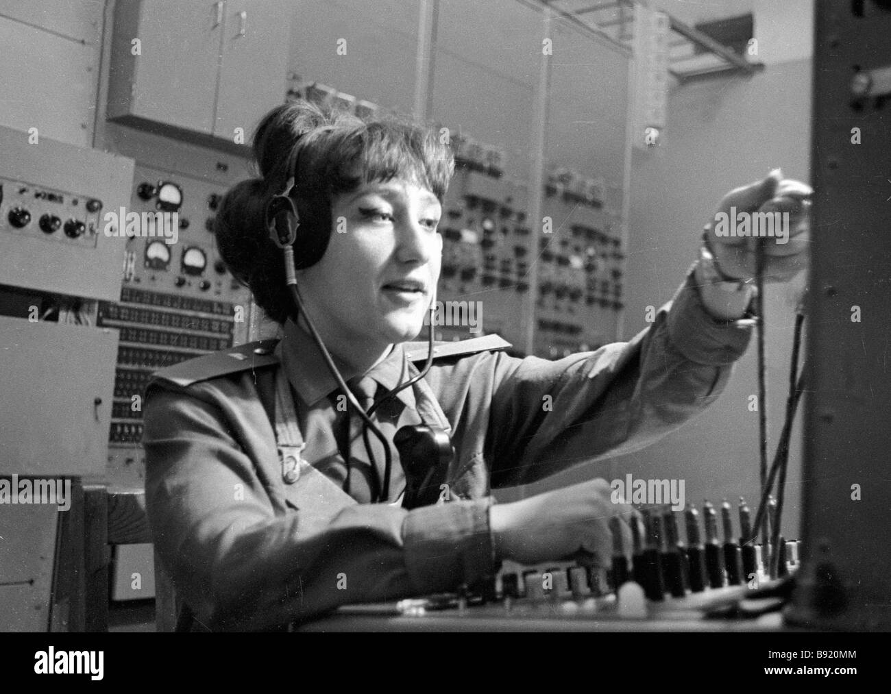 An enlisted female radio operator on watch duty Stock Photo - Alamy