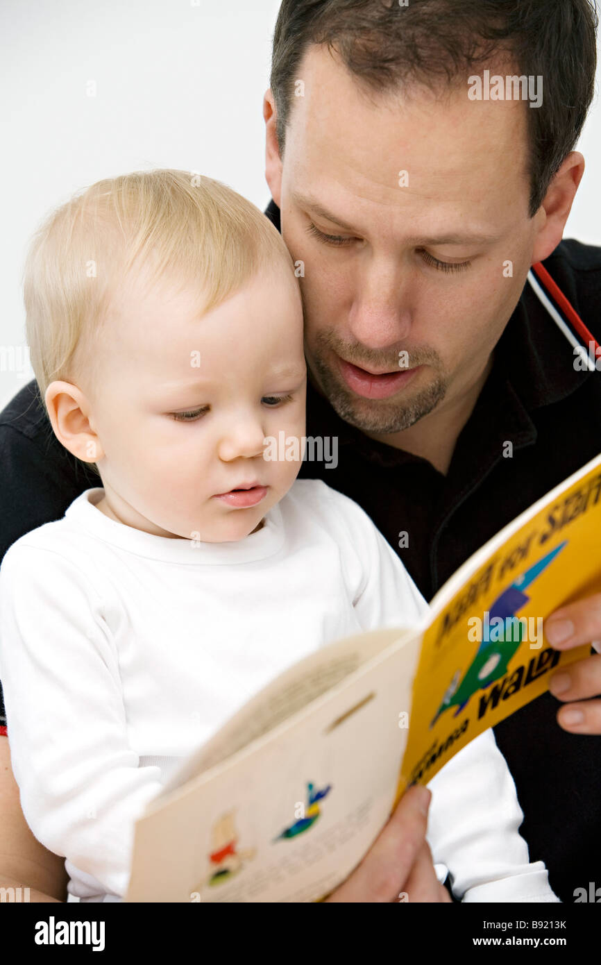 Father reading a book to his child Sweden Stock Photo - Alamy