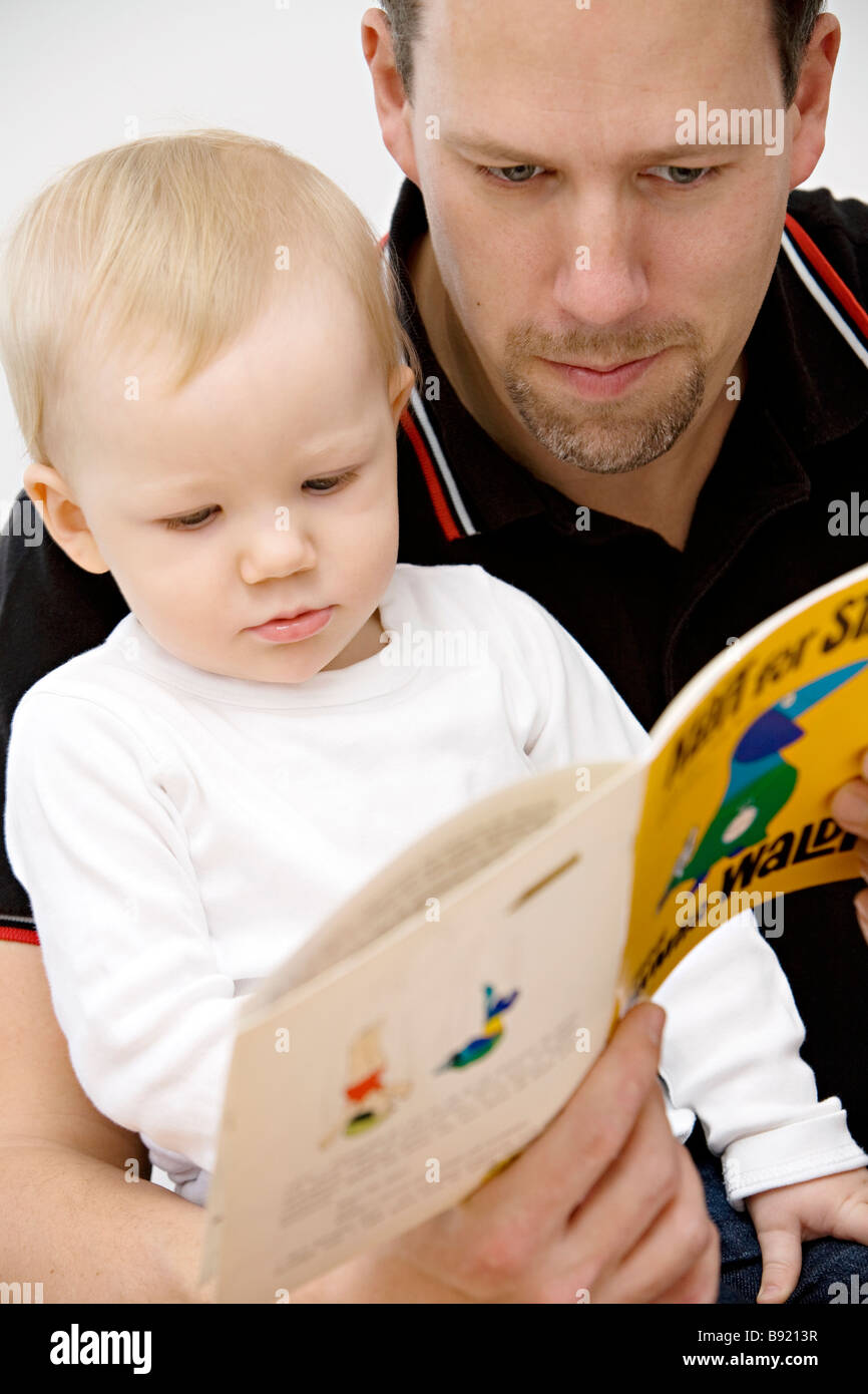 Father reading a book to his child Sweden Stock Photo - Alamy