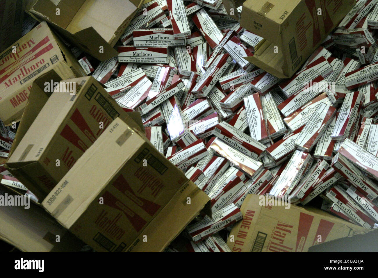A customs seized batch of cigarettes being destroyed at the state run ...