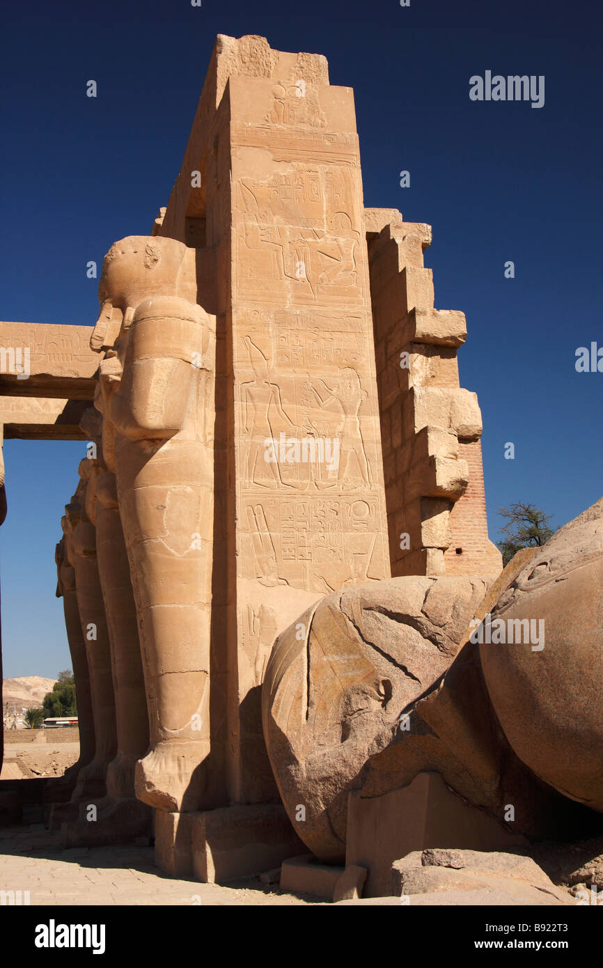 Ramesseum pylon wall and fallen statue ruins, [mortuary temple] of ...