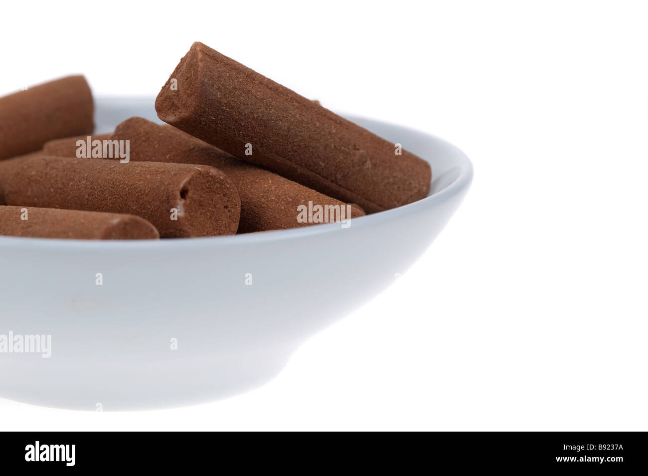 Cinnamon candy sticks in a bowl isolated on a white background Stock ...