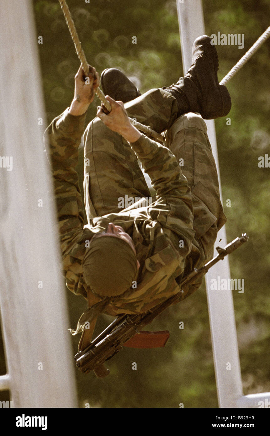Soldier climbing rope during exercise Scout unit of 149th motorized ...