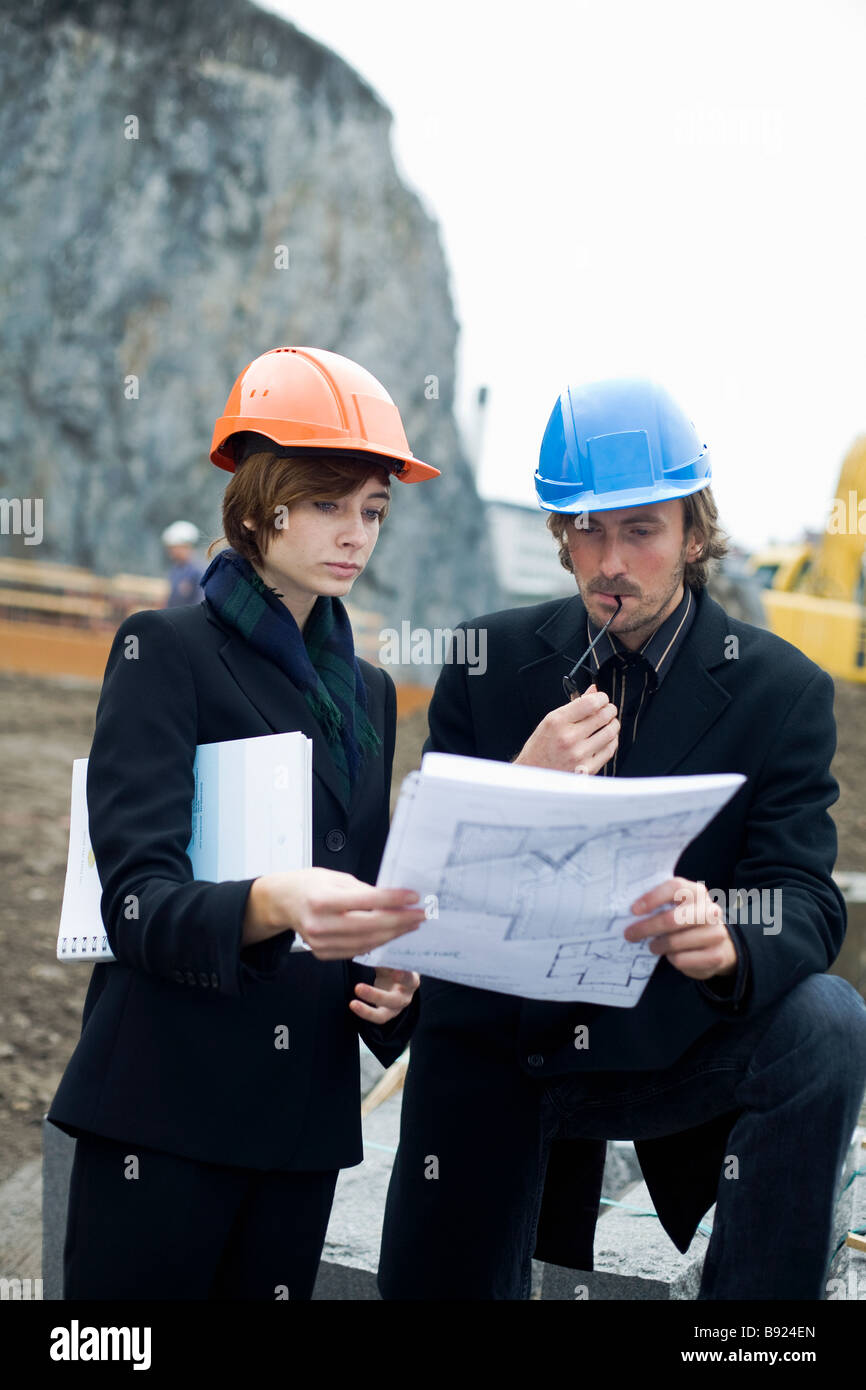 Project leaders at a building site a man and a woman Sweden Stock Photo ...