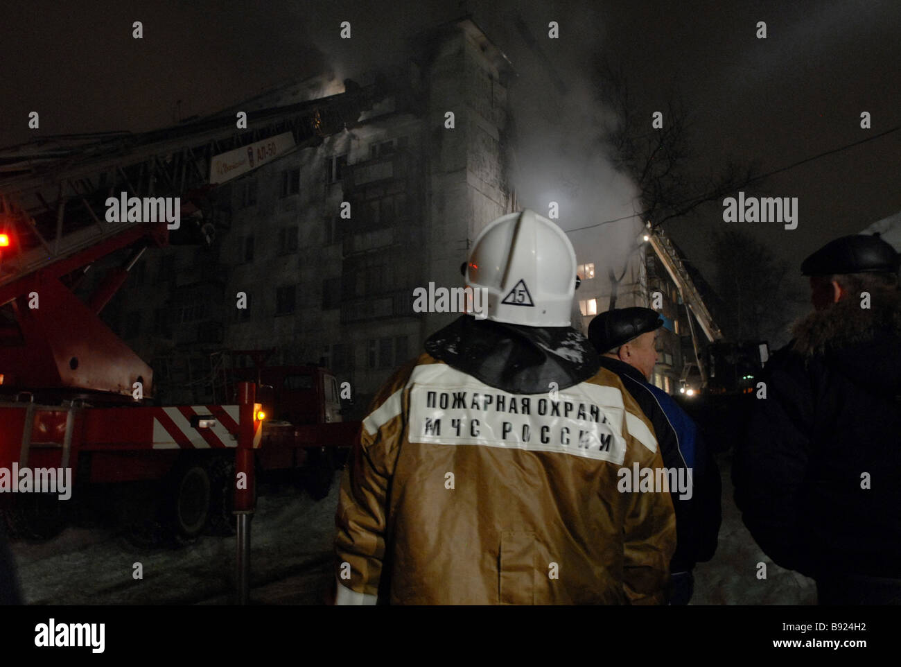 Clearing the debris after a gas explosion in an apartment building in ...