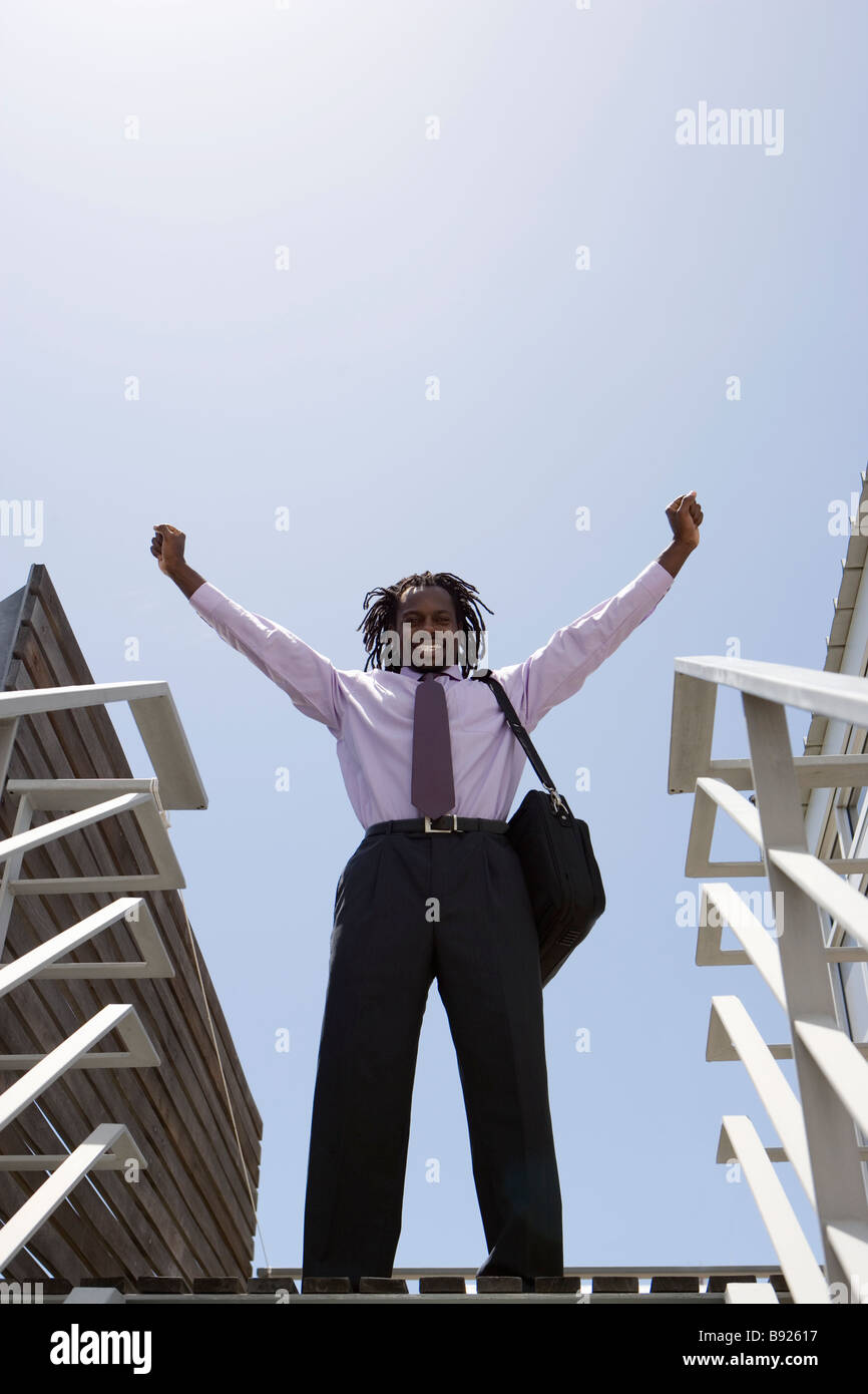 Businessman stretches his arms in celebration Cape Town Western Cape ...