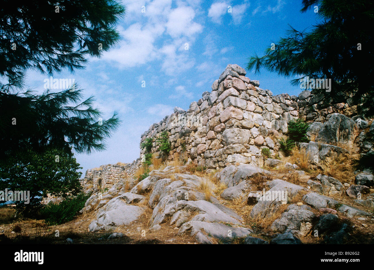 Tiryns, Greece. The massive Cyclopean walls of the Citadel. The shaft ...