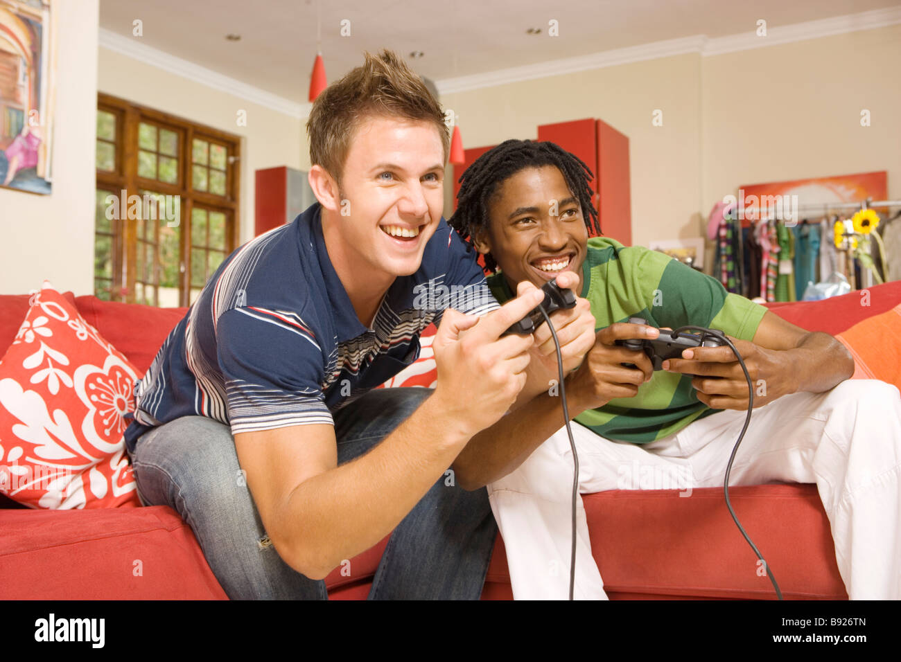 South African teen culture Young men playing TV games Stock Photo - Alamy