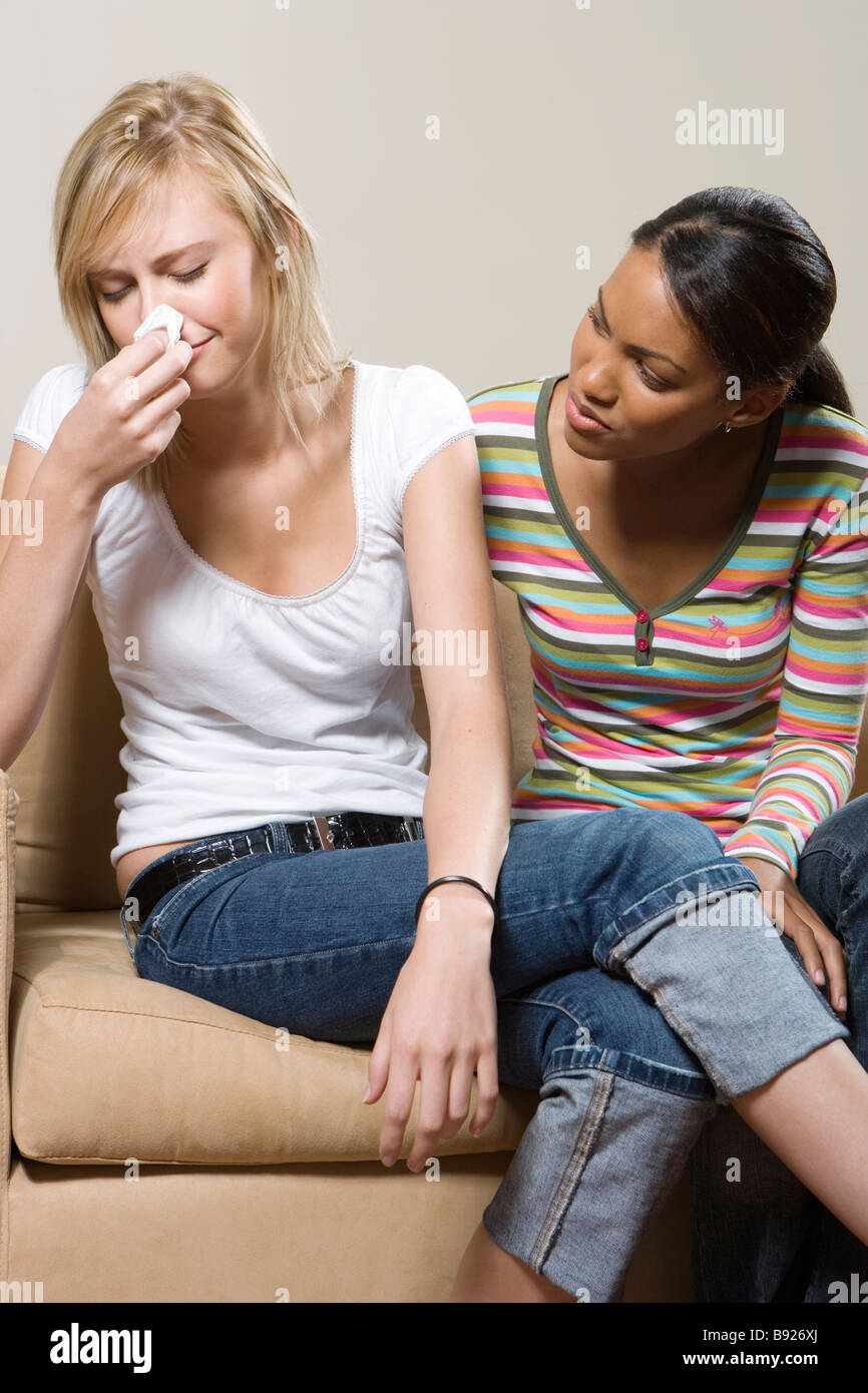 Two women consoling crying friend hi-res stock photography and images ...