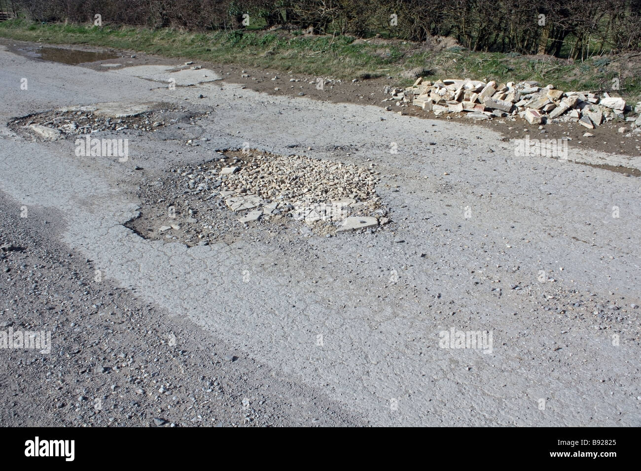 A poorly maintained road Stock Photo - Alamy