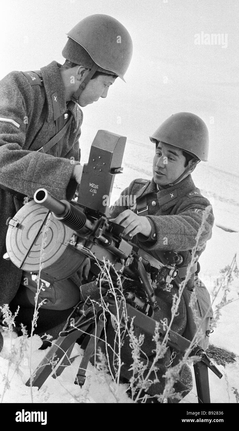 Soldiers are loading the AGS 17 Flame grenade launcher during a mock ...