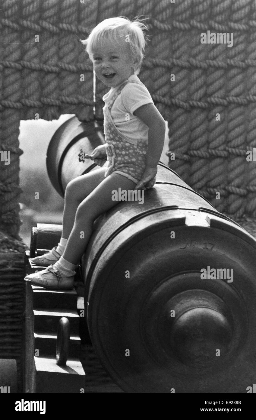 Child sitting on an old cannon barrel in the gun yard of Sevastopol s ...