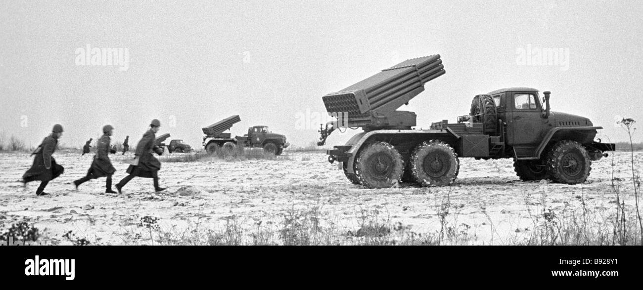 Multiple launch rocket system crews are running to BM 21 Hail launchers ...