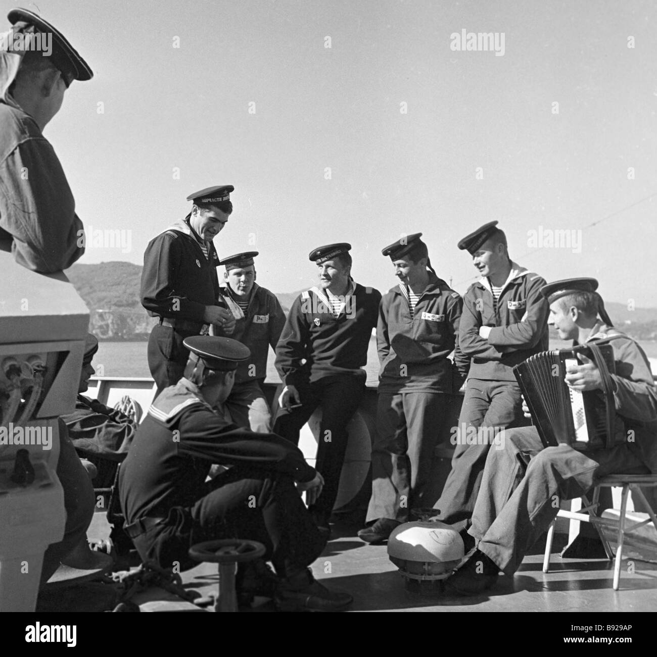Sailors of warship talk to each other on deck during their free time ...