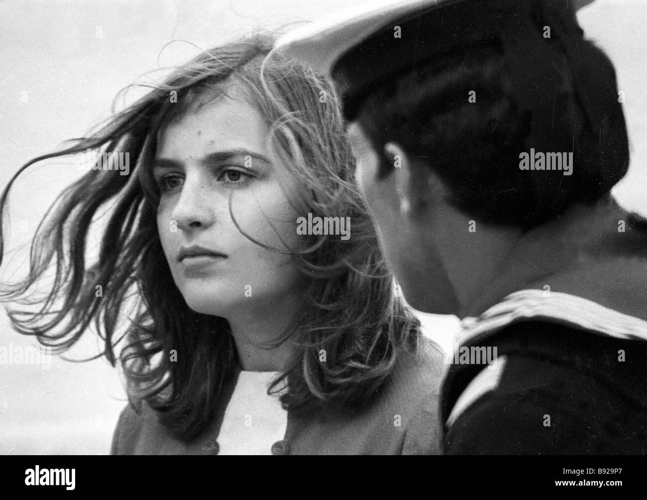 A seaman saying goodbye to a girl before sailing Stock Photo - Alamy