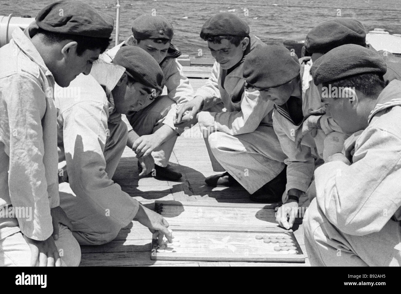 Armenian sailors playing backgammons on the cruiser Dzerzhinsky deck ...