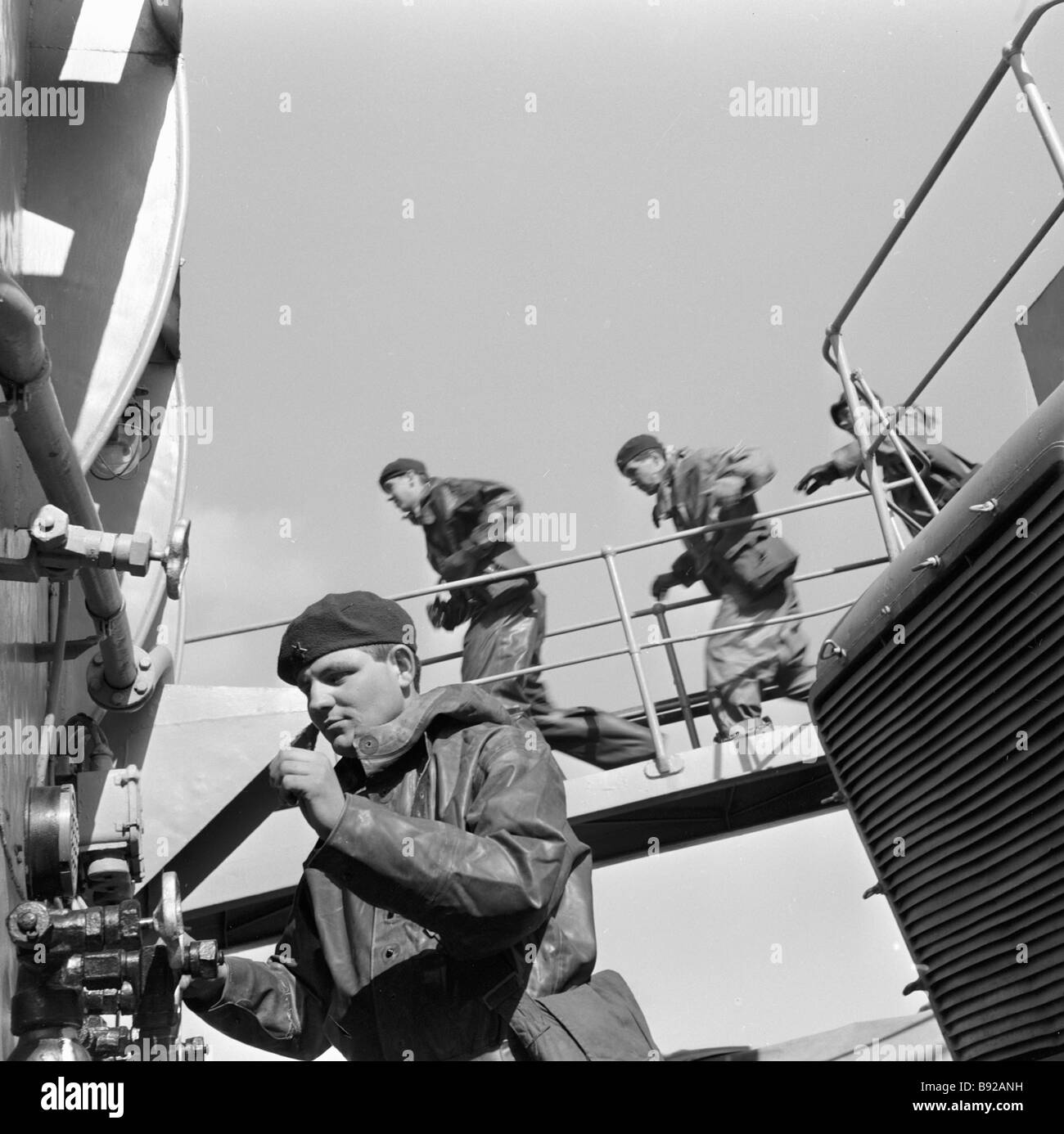 Sailors run after alarm signal sounds Stock Photo - Alamy