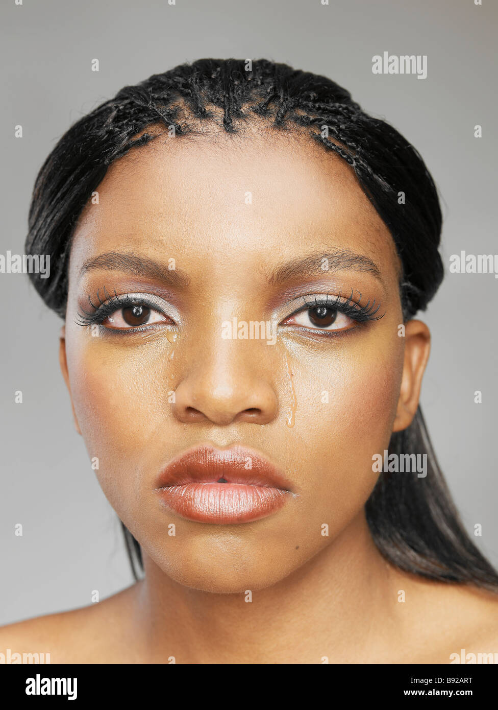 Woman crying tears running down cheeks Stock Photo - Alamy