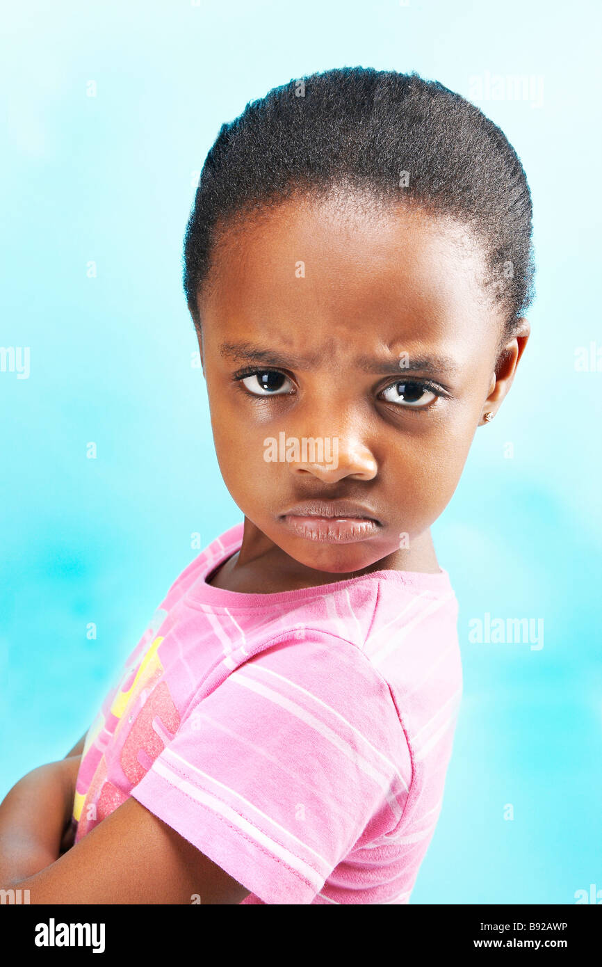 Young girl sulking with arms folded Stock Photo - Alamy