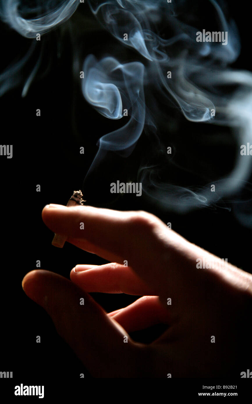 Roll up cigarette lit hi-res stock photography and images - Alamy