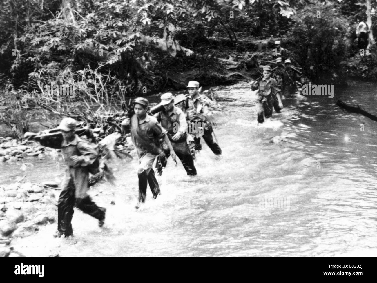 Laotian people s liberation army soldiers cross the river during the ...